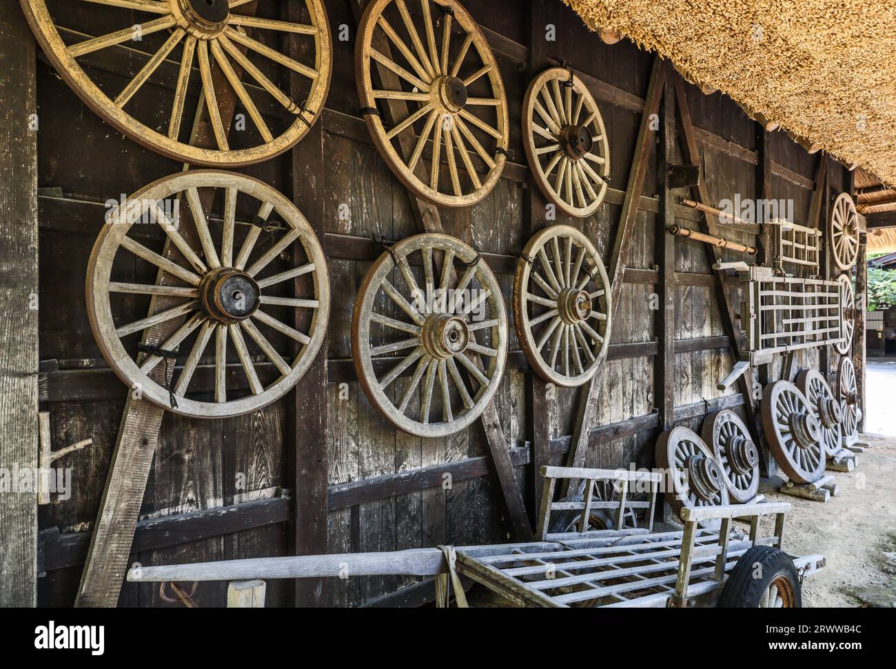 Hida village carts and a view of many wheels displayed on the outside ...