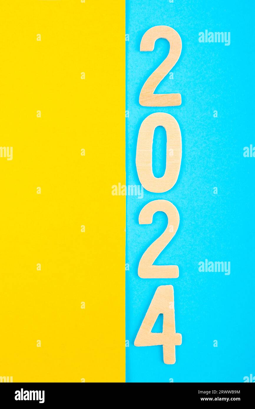 Number 2024 made from wooden on yellow and blue background Stock Photo ...
