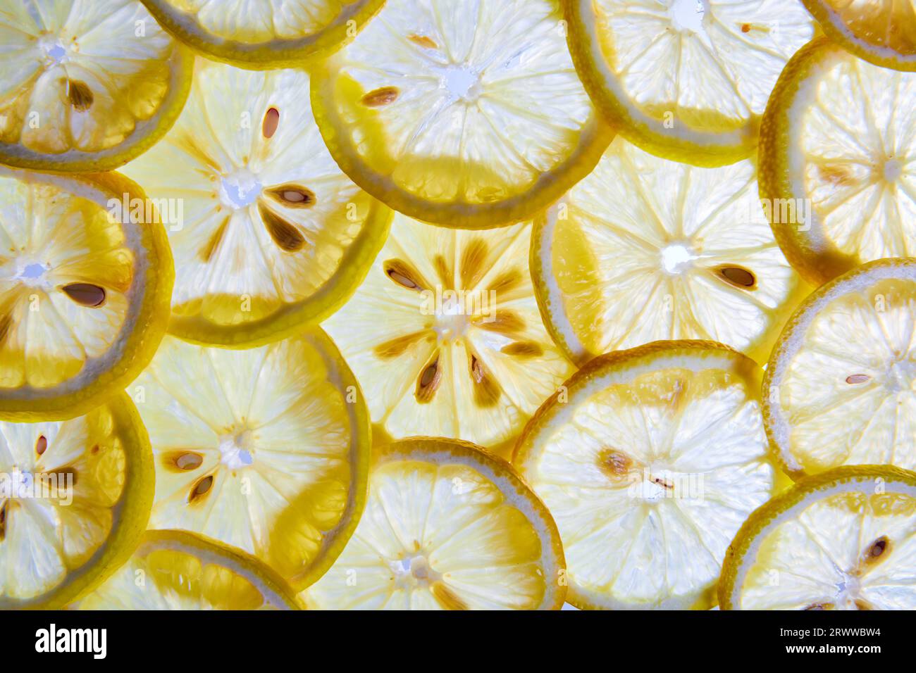 Wall of overlapping lemon slices in background asset of citrus fruit Stock Photo - Alamy