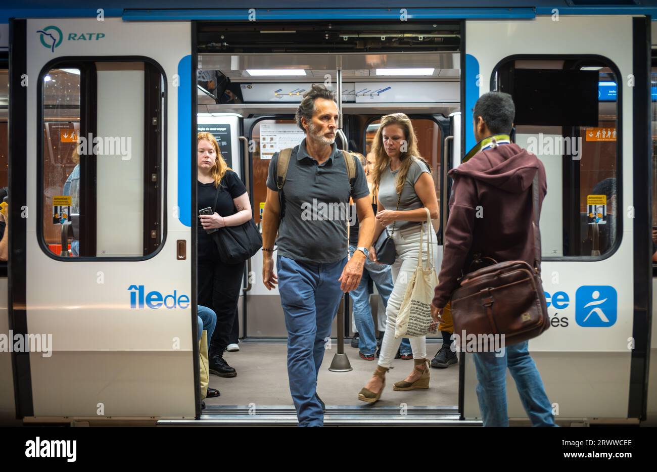 Passengers step off a Paris Metro train at the steampunk-inspired Arts ...