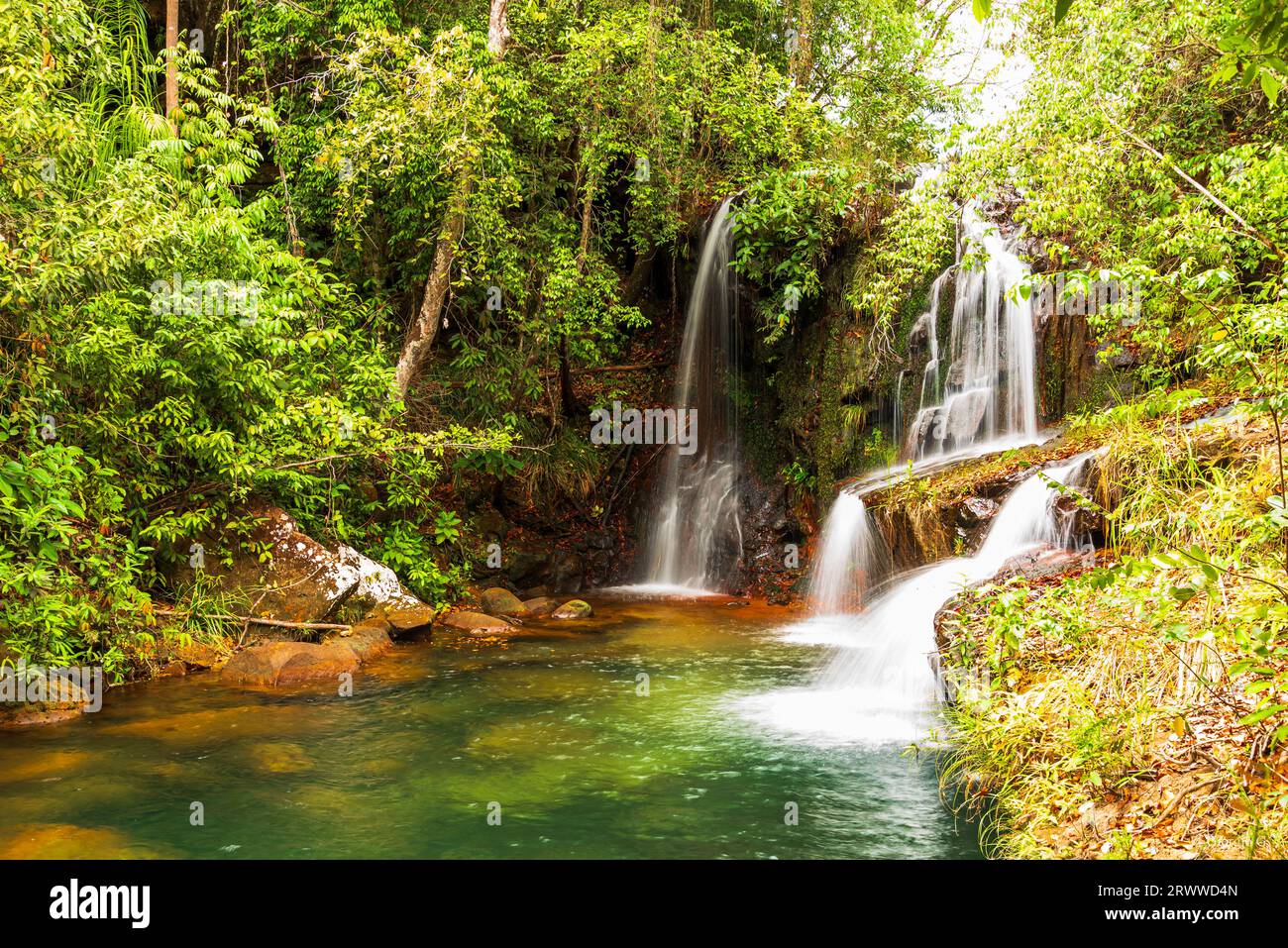 Beautiful natural cascades flowing into a pond in the countryside of ...