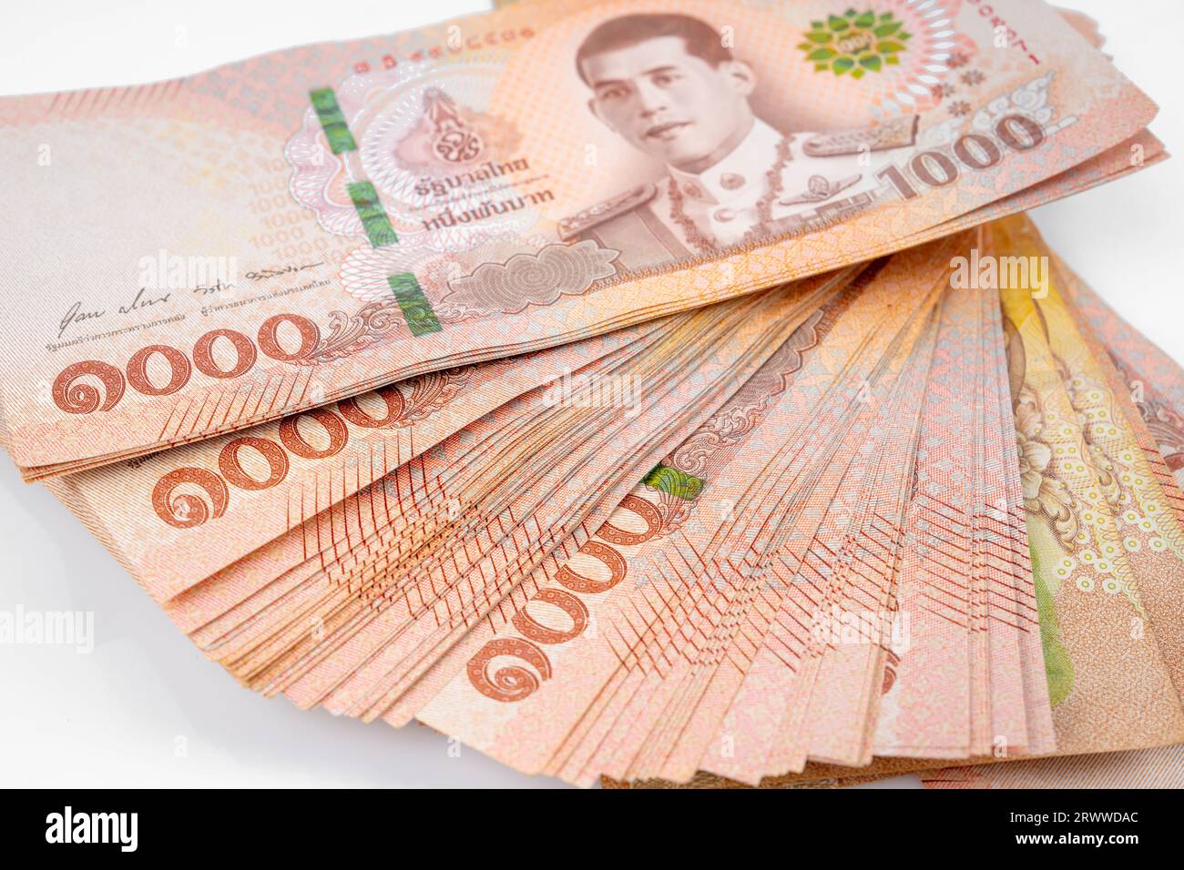 Heap of Thai 1,000 baht banknotes issued by the Bank Of Thailand Stock ...
