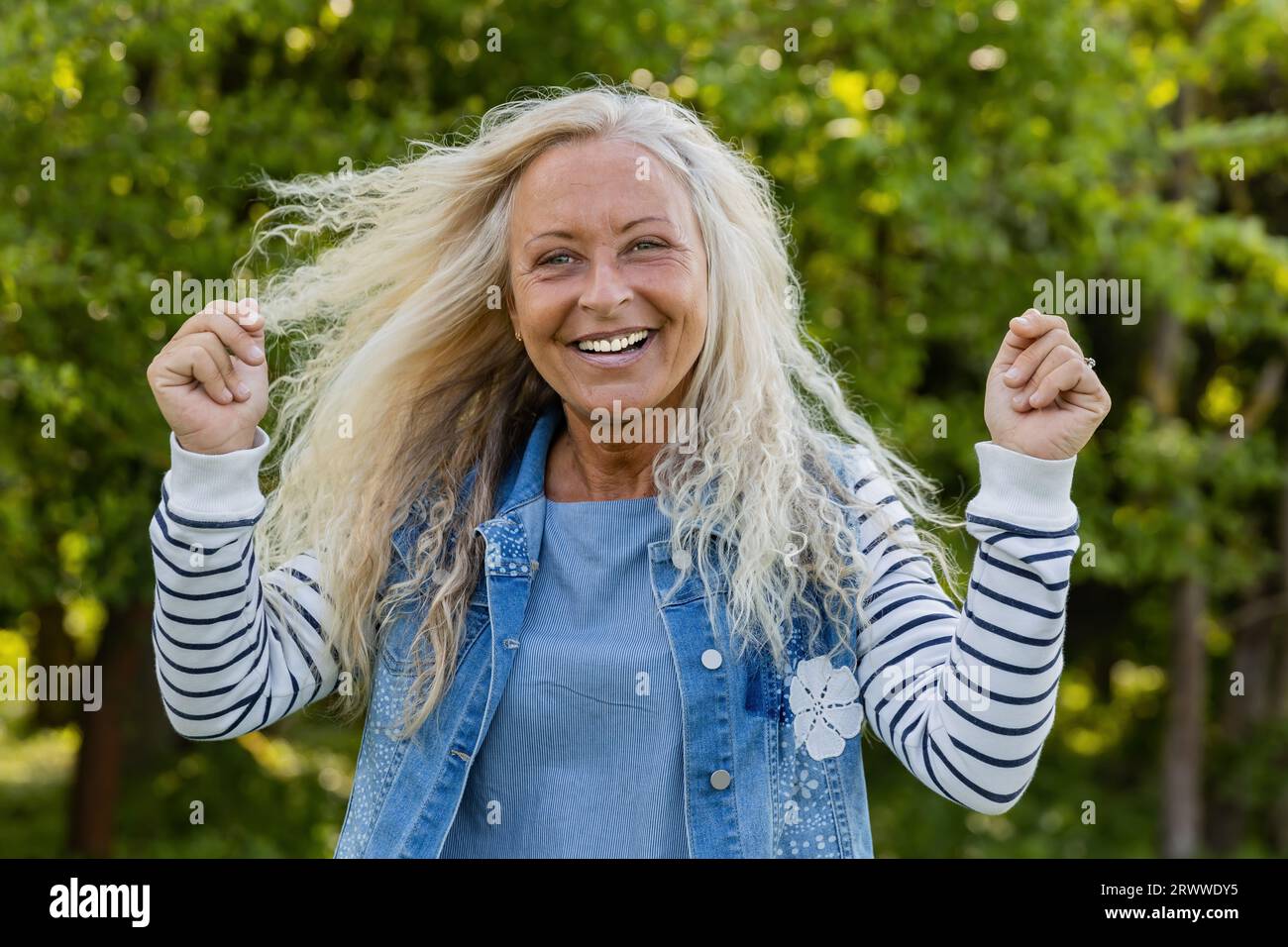 Portrait from happy caucasian woman with log hair Stock Photo - Alamy