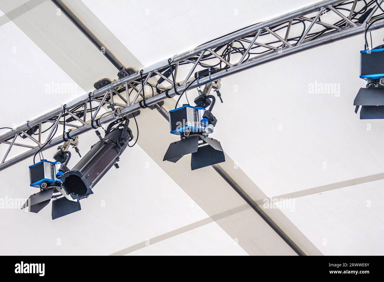 Stage lighting hanging on scaffolding in a event tent Stock Photo - Alamy
