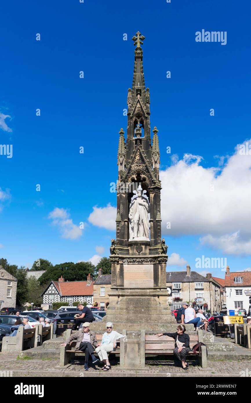 People sitting at the Memorial to second Baron Feversham in Helmsley ...