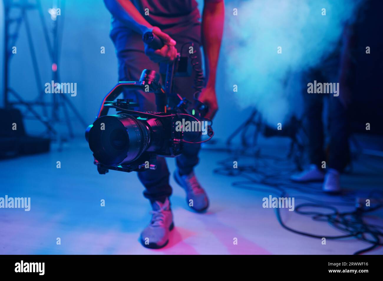 African american cameraman using hi-res stock photography and images ...