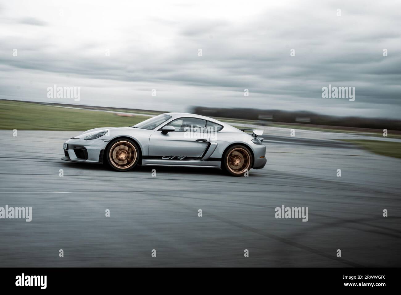 Drifting Porsche car at race track Stock Photo - Alamy