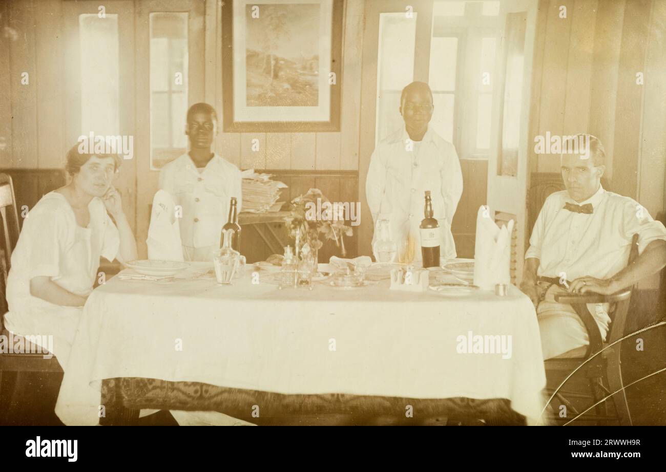 Alfred and DorothyTamlin sit at a dining table about to eat a meal ...