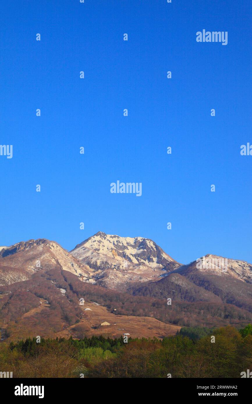 Mt. Myoko at morning glow seen from Imori-ike Pond in Myoko Plateau ...