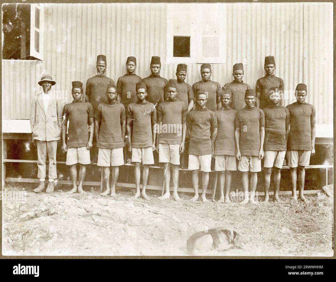 Group photograph of apprentices standing outside the Public Works ...