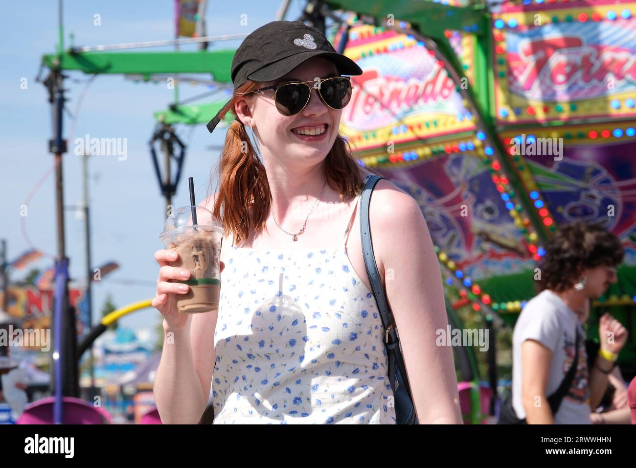 People riding on spinning swing carousel in amusement park Swing rides ...
