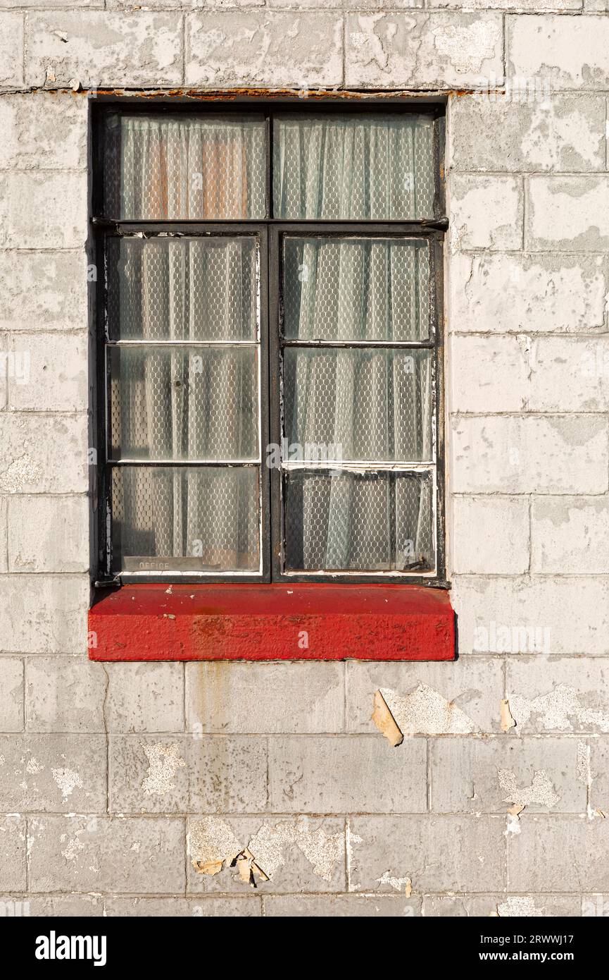 Exterior of old window in a cinder block building Stock Photo - Alamy