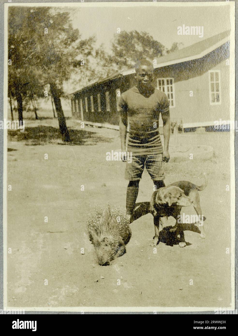Mrs Bungey stands in the brush on a hillside, posing with a double ...
