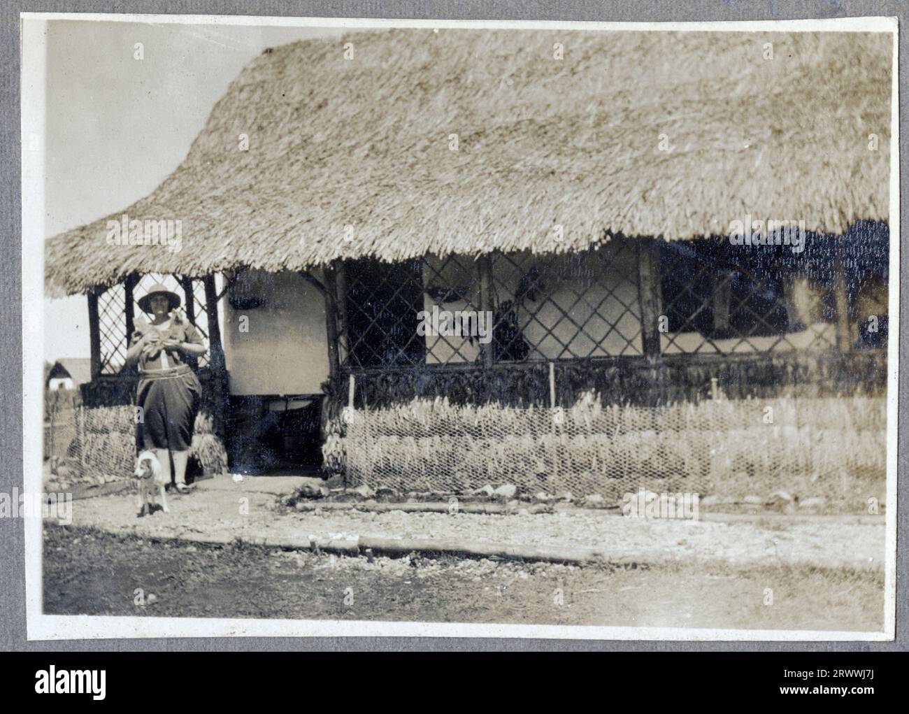 May Bungey with family friends standing in the shade in front of a ...