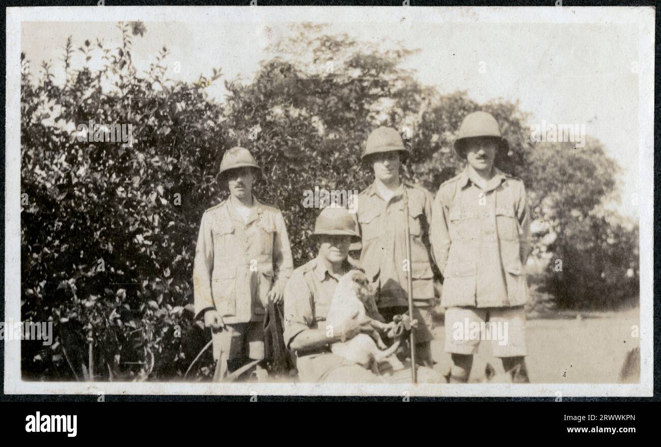 Informal group photograph of four European soldiers in safari dress ...