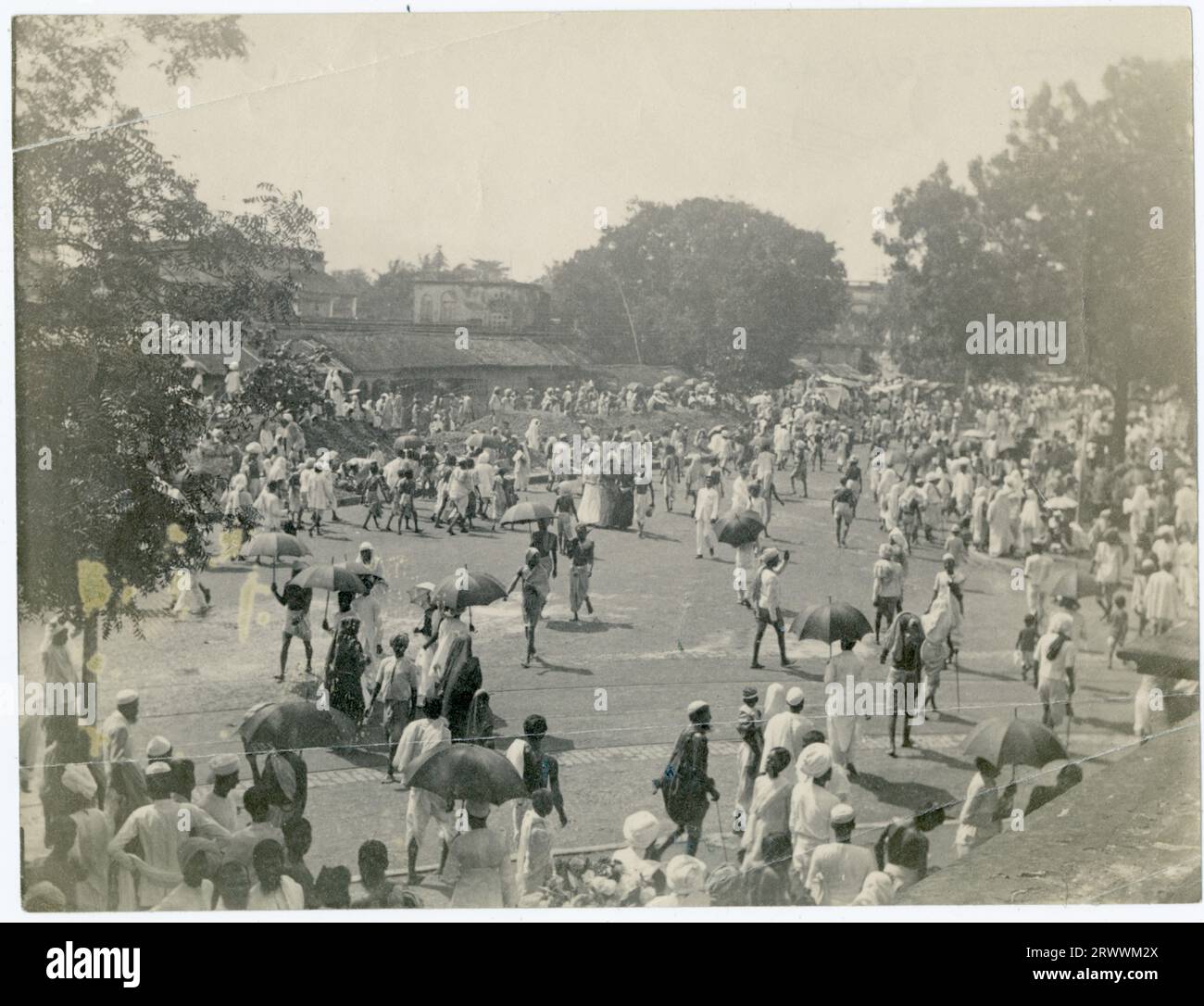 Religious procession showing horse-drawn carts amongst a large festival ...