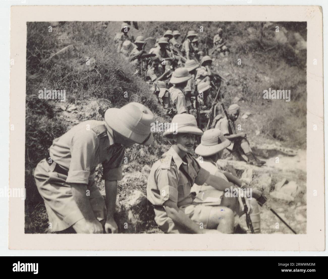 Detachment of soldiers in pith helmets. Caption reads: 36 - Another ...
