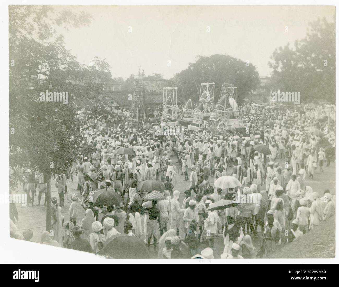 Religious procession showing horse-drawn carts amongst a large festival ...