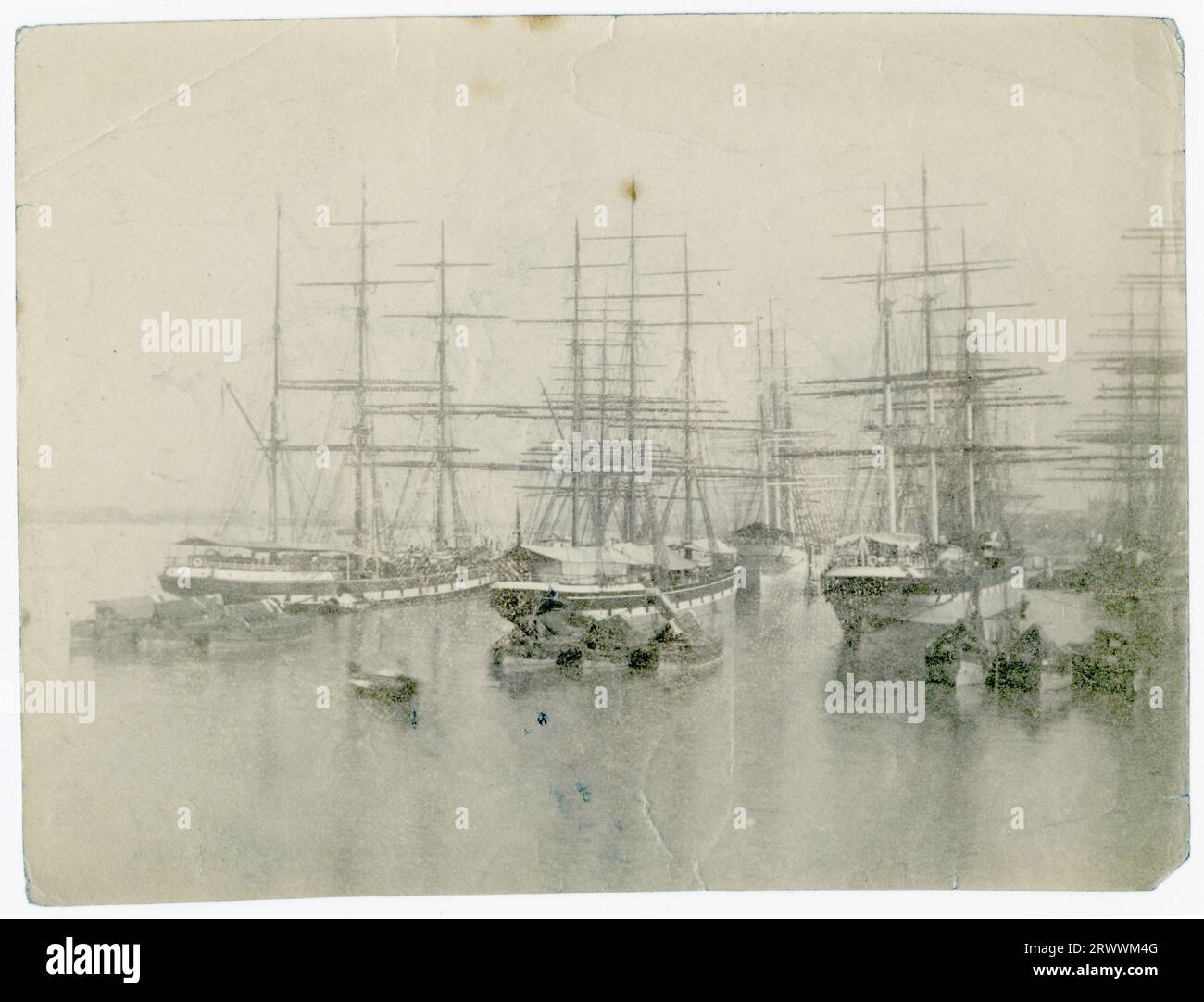 View of large sailing ships in a dock in Calcutta. There are several ...