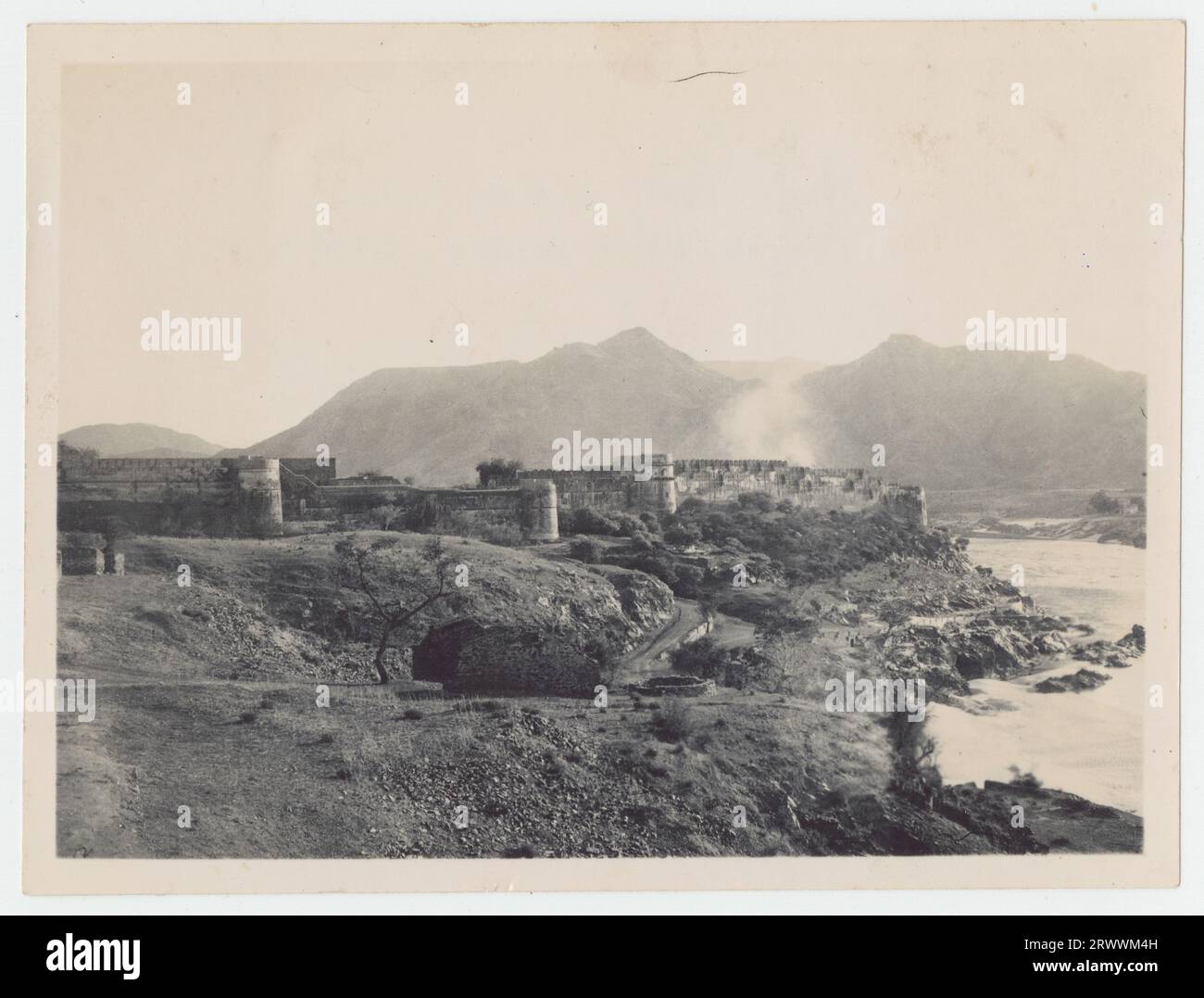 View of fort beside river with hills in background. Caption reads: 31 ...