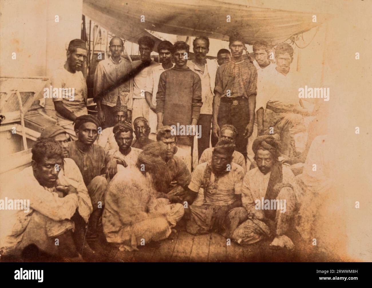 Group portrait of twenty-four men on deck after being rescued from the ...