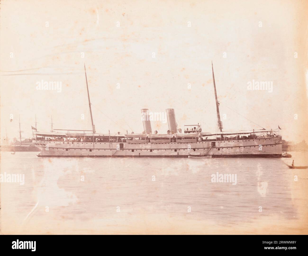 View of a steamship with two funnels and two lower decks in a harbour ...