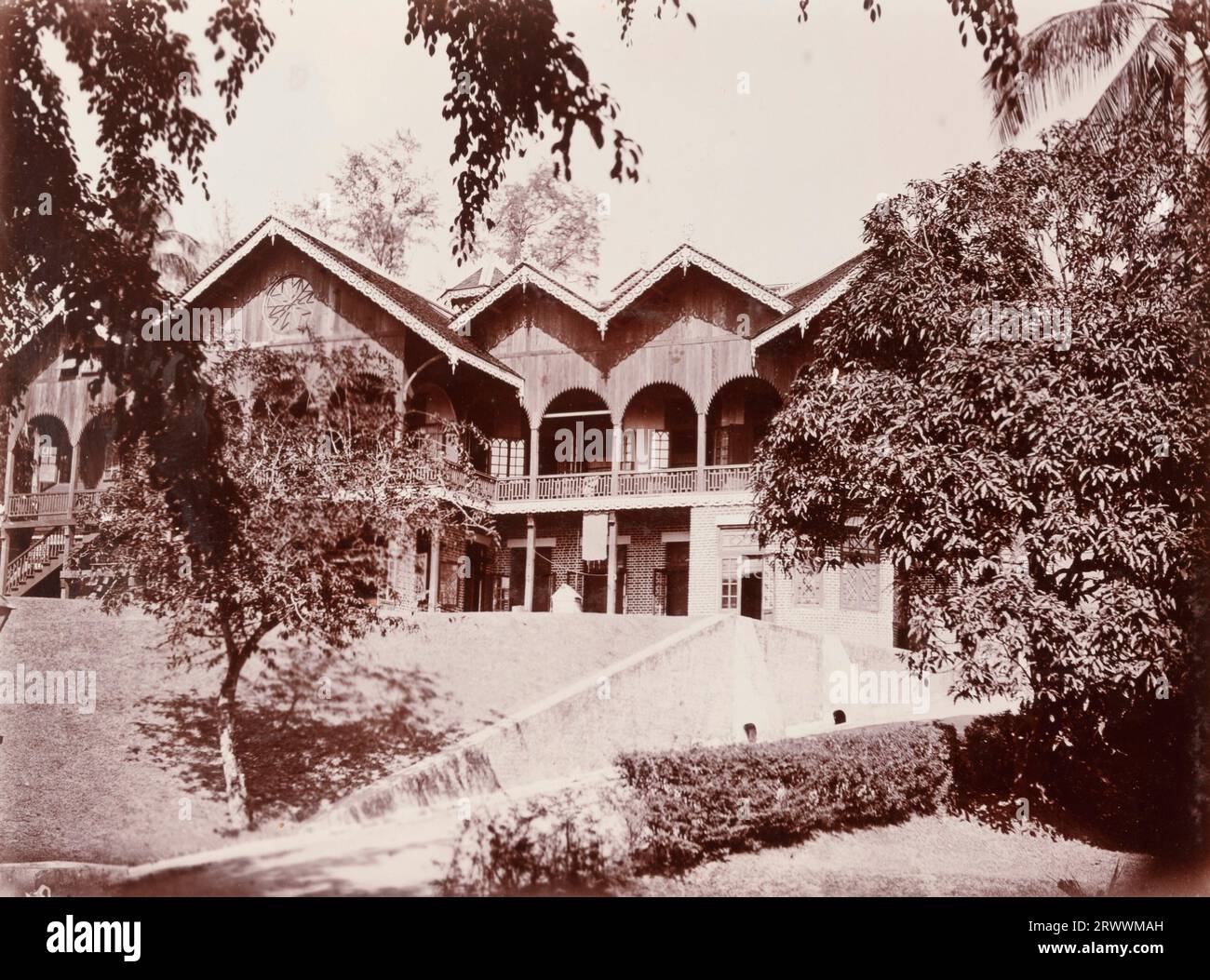 View of a multi-gabled, two storey club house set amongst landscaped ...
