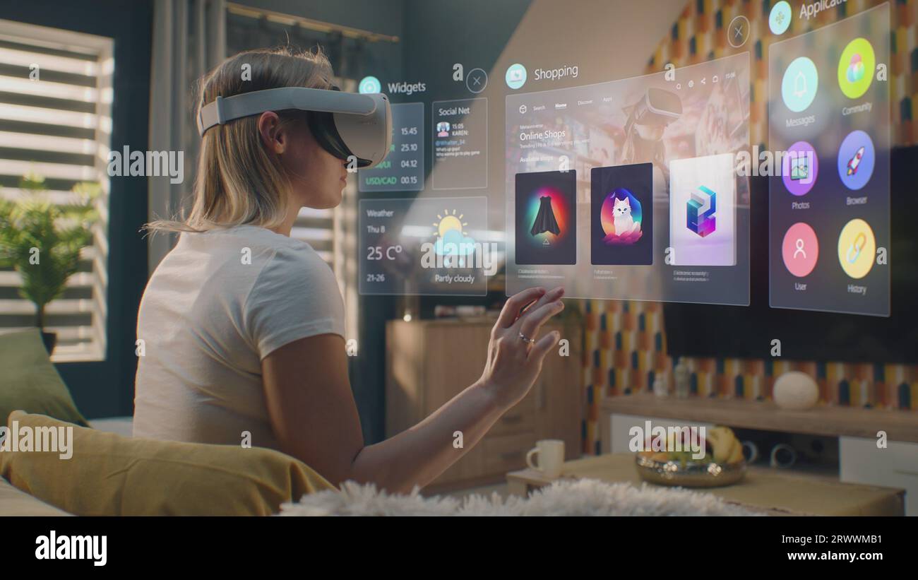 Woman in VR headset chooses clothes in online store chilling at home ...