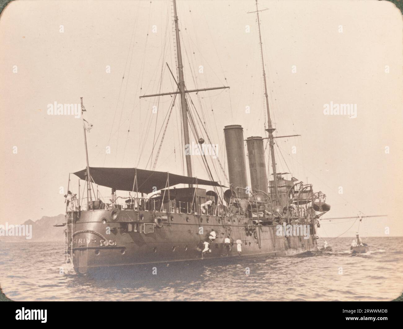 Rear view of a twin-funnelled, three-masted, medium-sized ship. Note on ...