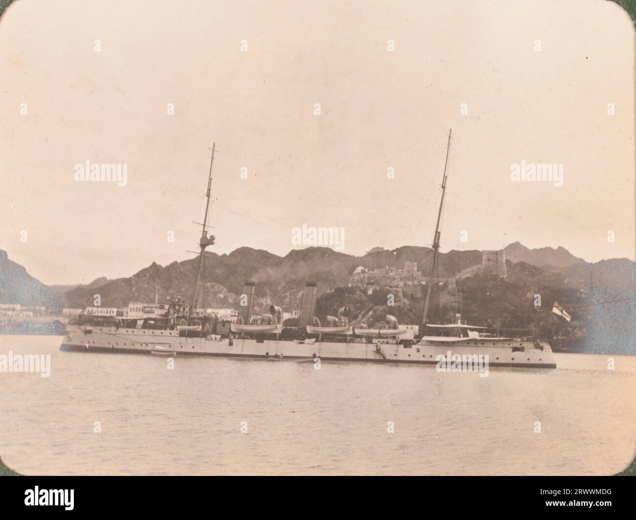 Side view of a twin-funnelled, two-masted vessel of medium size, at ...