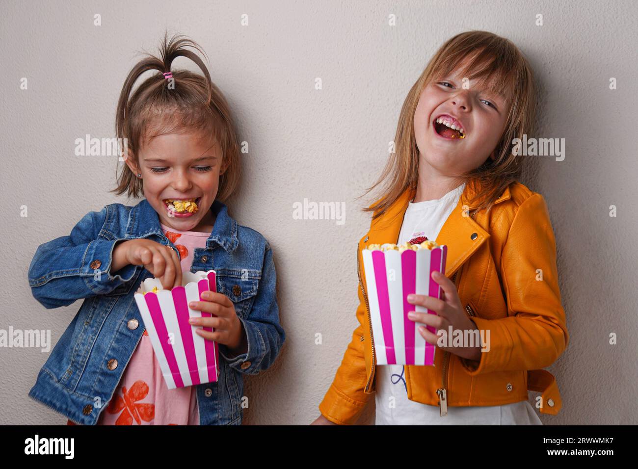 Little girls eating snacks hi-res stock photography and images - Alamy