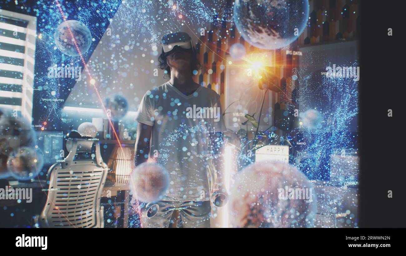 Man uses augmented reality goggles and wireless controllers at home. 3D ...