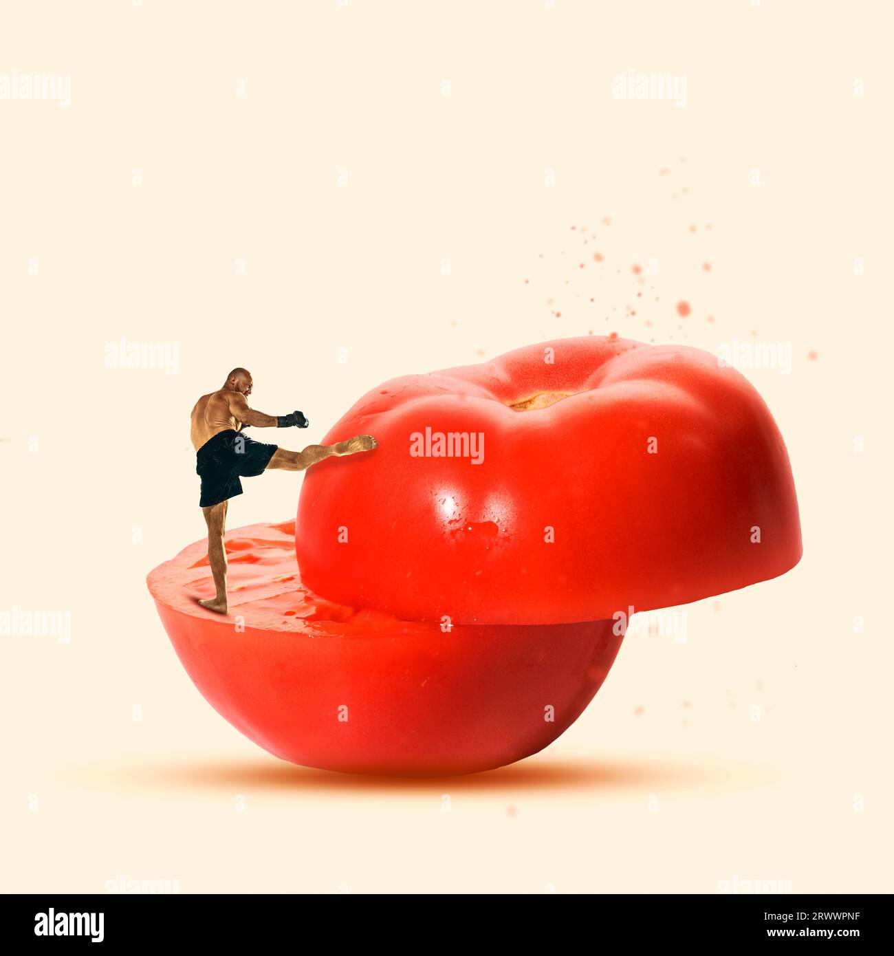 Athletic man, mma fighter in motion, hitting tomato with leg. Choosing ...