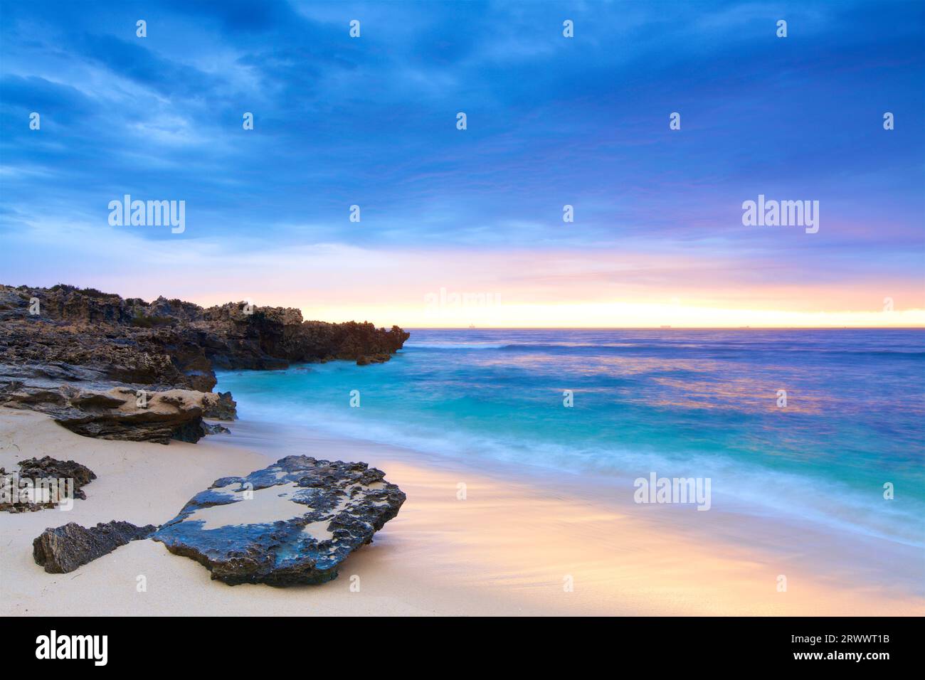 Dramatic sunset at a small cove with limestone rocks just south of ...