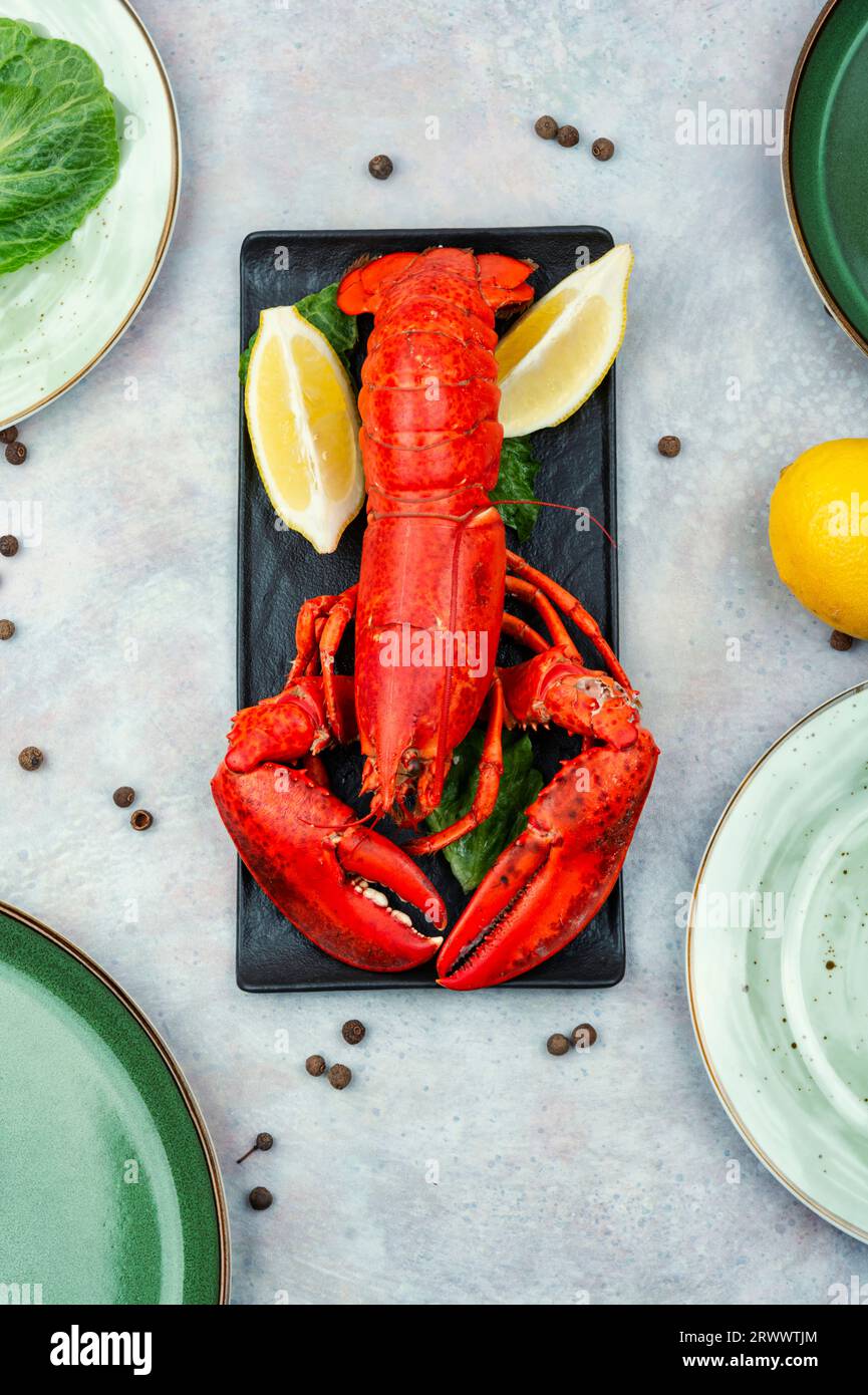 Cooked lobster with lemon on a tray. Seafood. Top view Stock Photo - Alamy