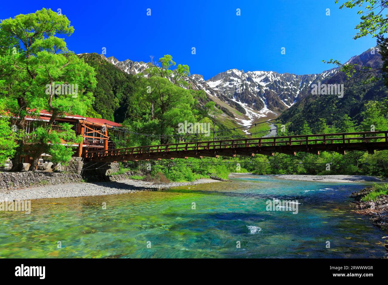 Kappa-bashi Bridge and lingering snow on the Hotaka mountain range in ...