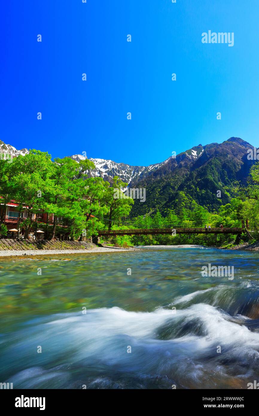 Kappa-bashi Bridge and lingering snow on the Hotaka mountain range in ...