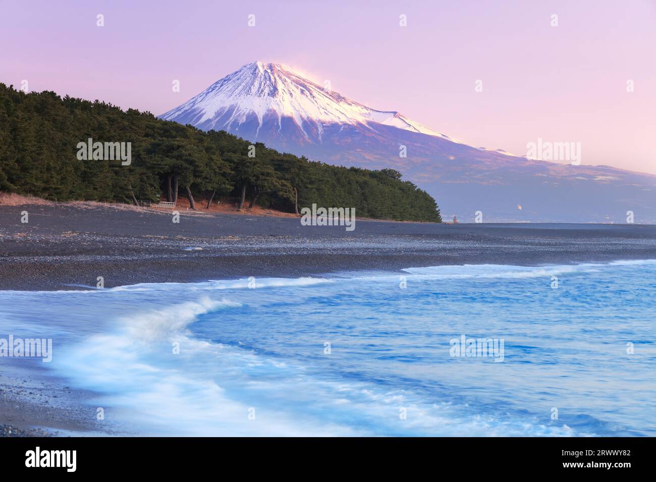 Mt. Fuji in the morning glow with the waves at Miho Pine Plain Stock ...