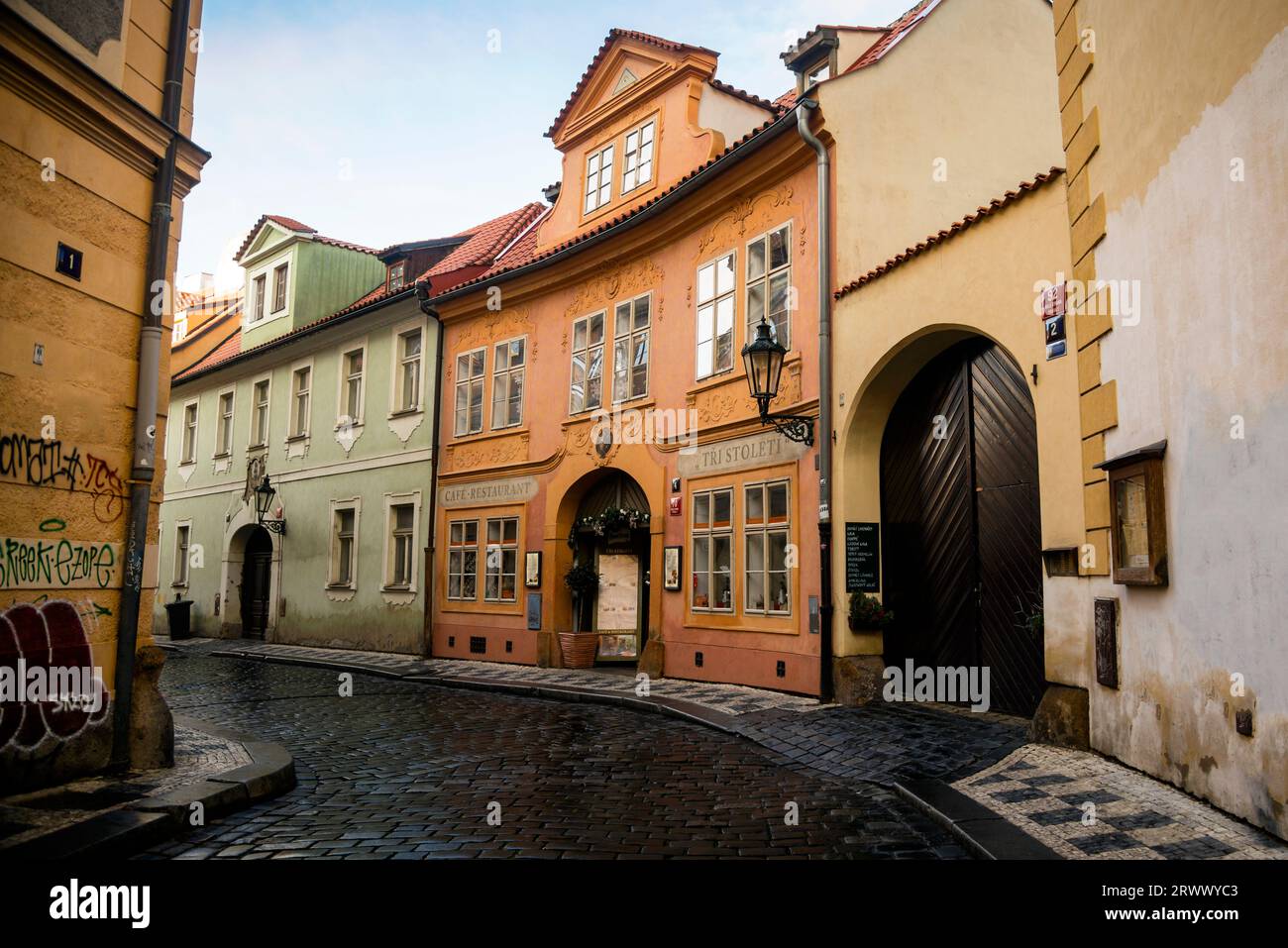 Bohemian Baroque architecture on cobblestone street in Prague, Czech ...