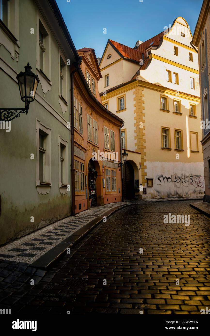 Bohemian Baroque architecture on cobblestone street in Prague, Czech ...