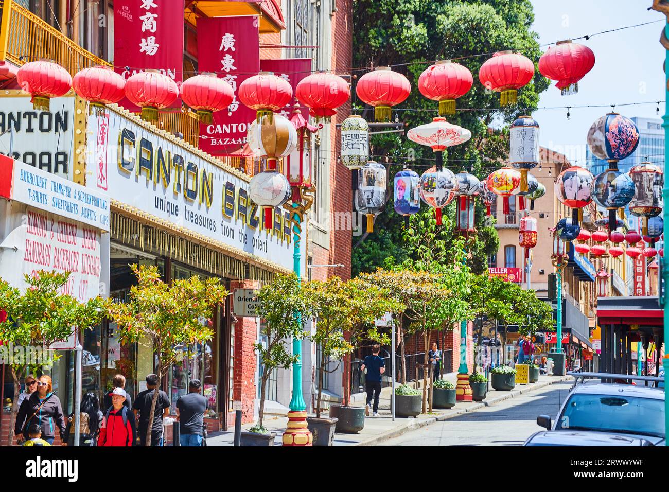 Busy street in Chinatown with colorful hanging lanterns and shops with ...