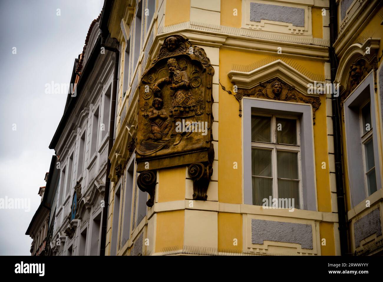 Corner relief sculpture of a baptism in Prague, Czech Republic Stock ...