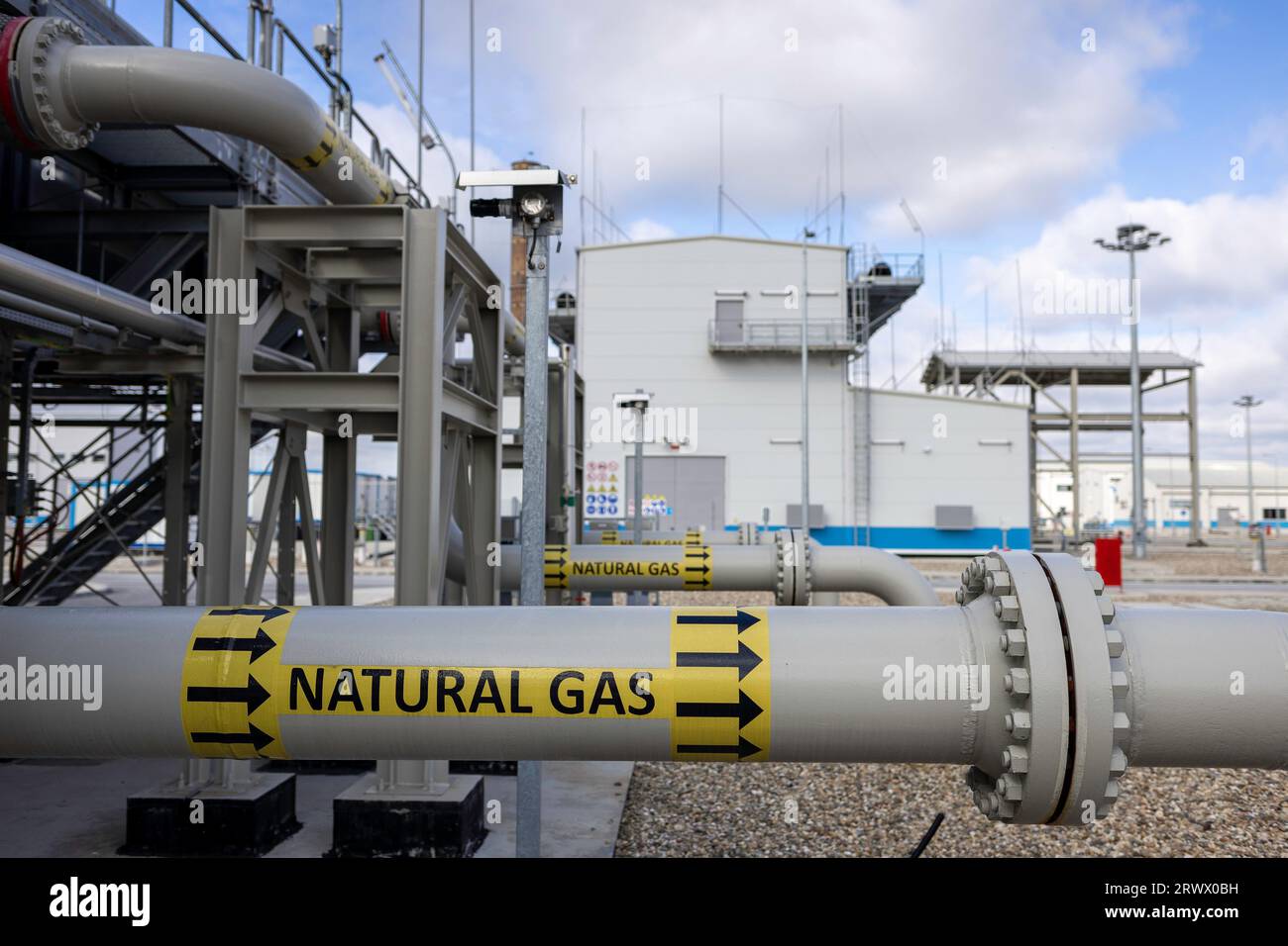 Natural gas main high pressure pipeline with yellow label Stock Photo - Alamy
