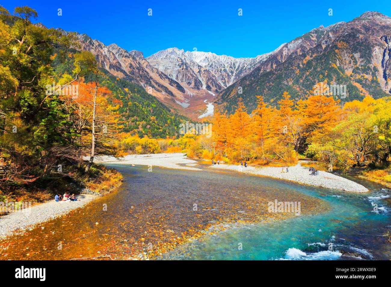 Snow on the clear stream of Azusa River and the Hotaka mountain range from Kappa-bashi Bridge ...
