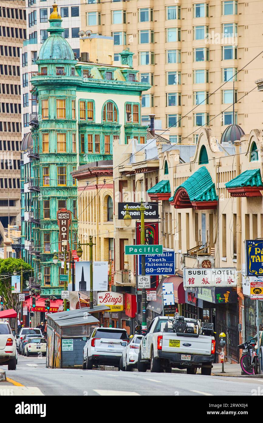 Street view of Chinatown shops and restaurants with apartment buildings ...