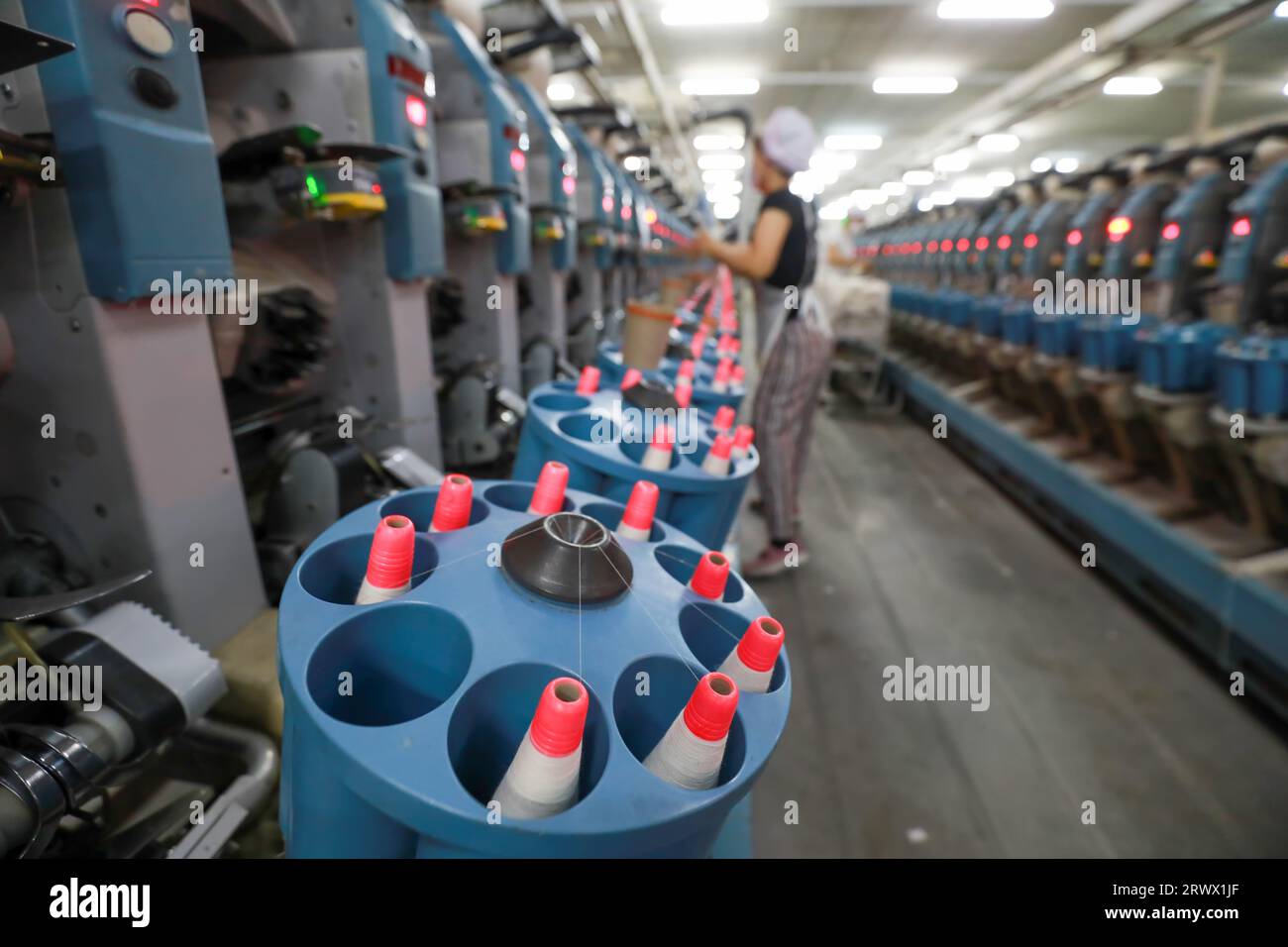 The spinning worker is working nervously on the spinning production ...