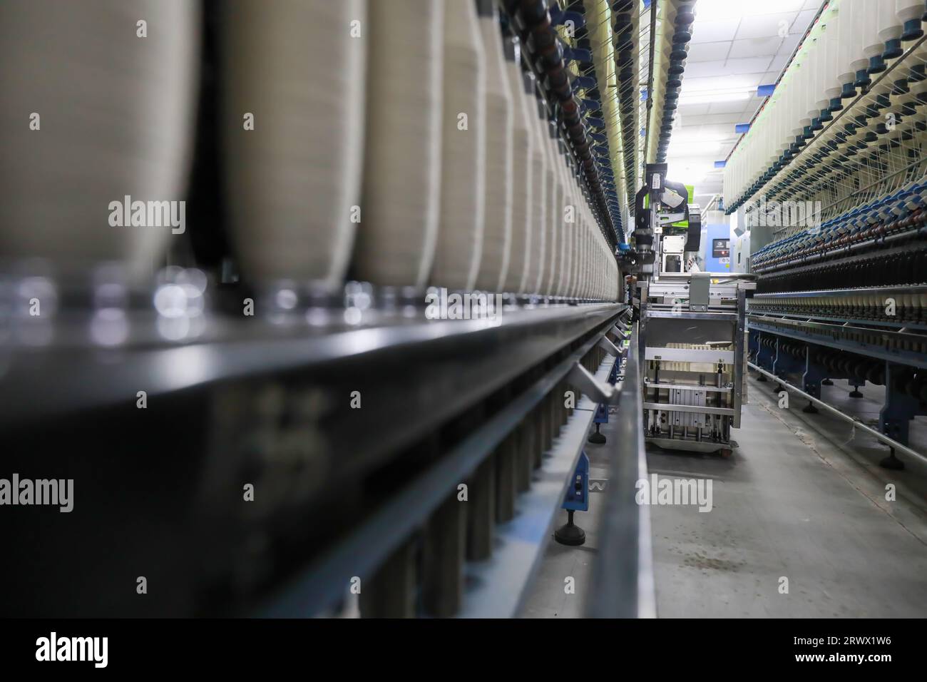 The automatic doffing robot is performing doffing operations in a ...