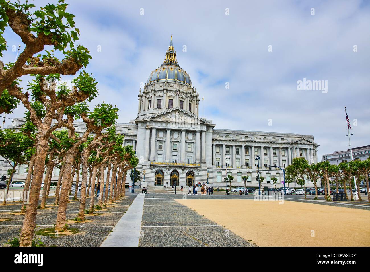 Sandy entrance leading to pedestrians in front of city hall with ...