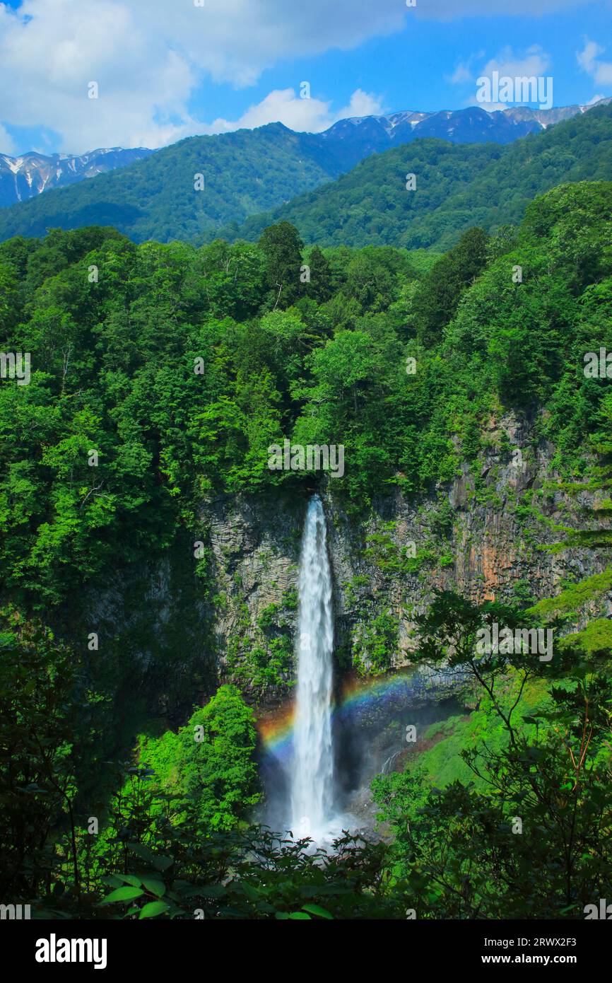 Rainbow over the Hakusan mountain range with lingering snow and Hakusui Waterfall Stock Photo ...