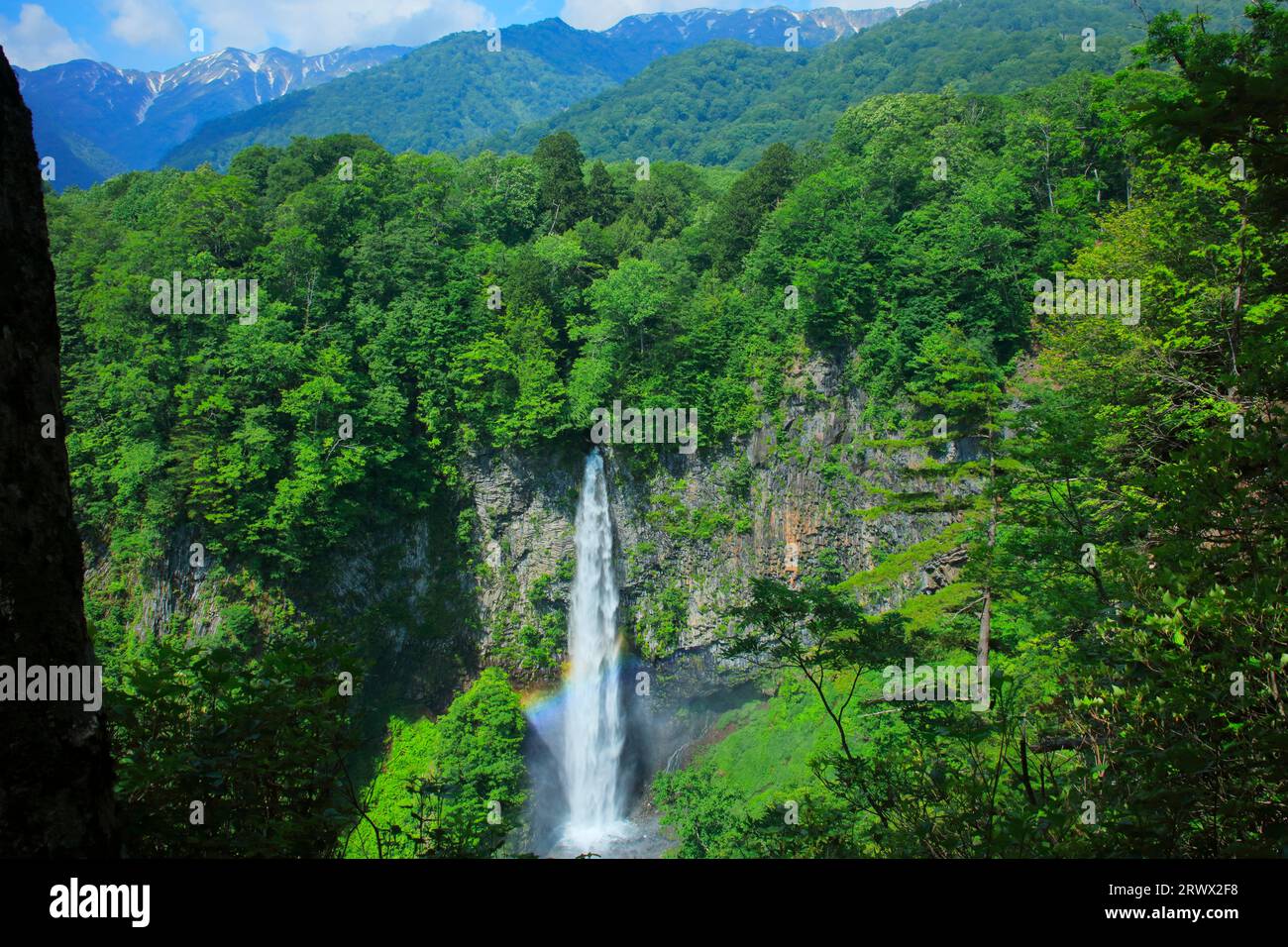 Rainbow over the Hakusan mountain range with lingering snow and Hakusui ...